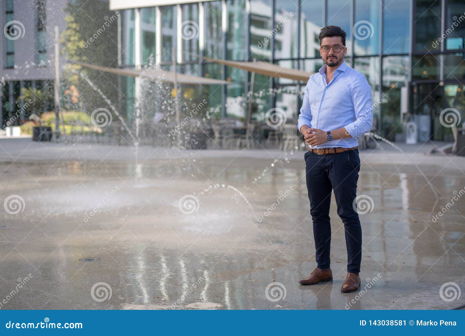 Successful Young Business Man Standing Outside Looking into the Camera ...