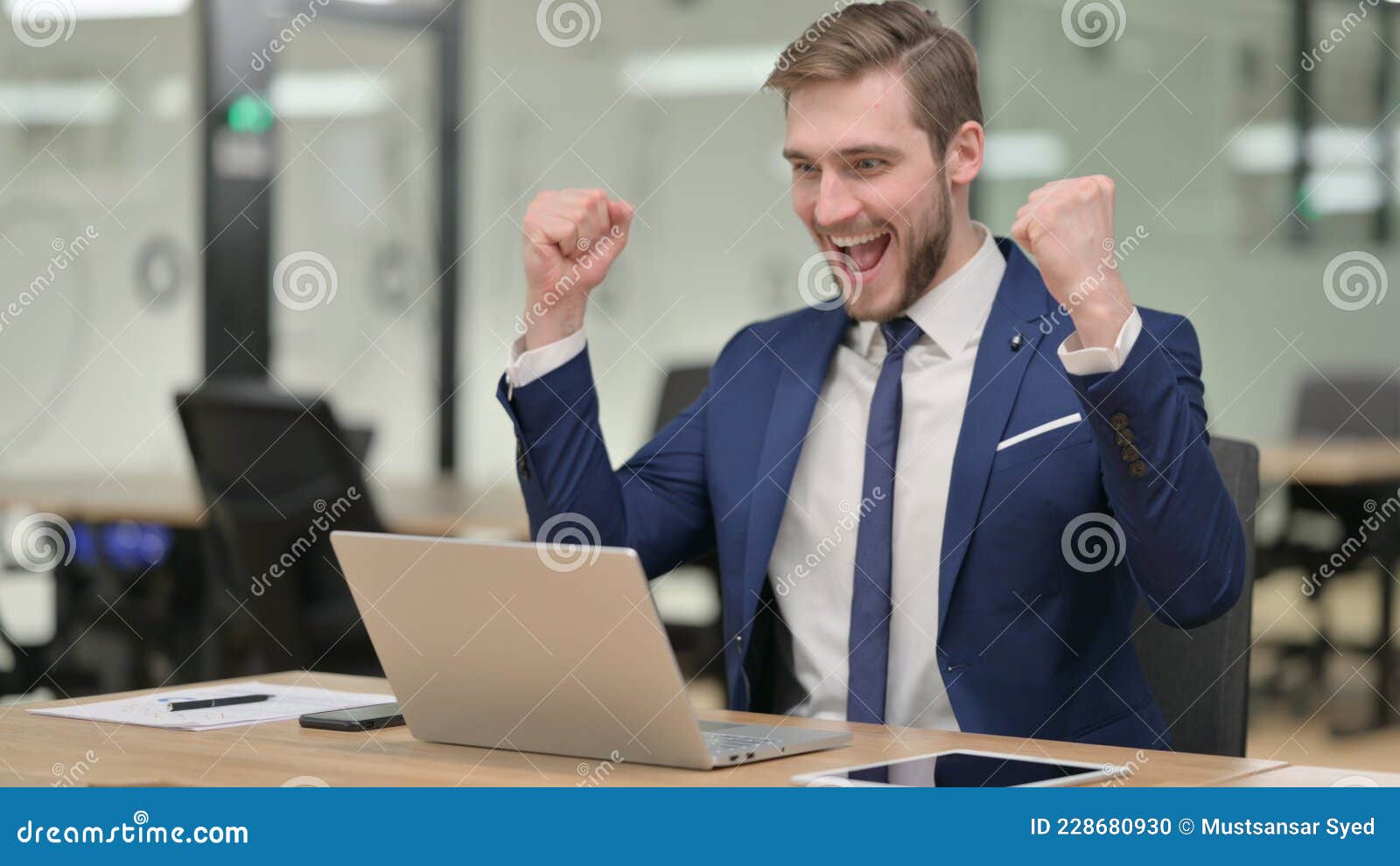 Businessman Celebrating on Laptop at Work Stock Photo - Image of ...