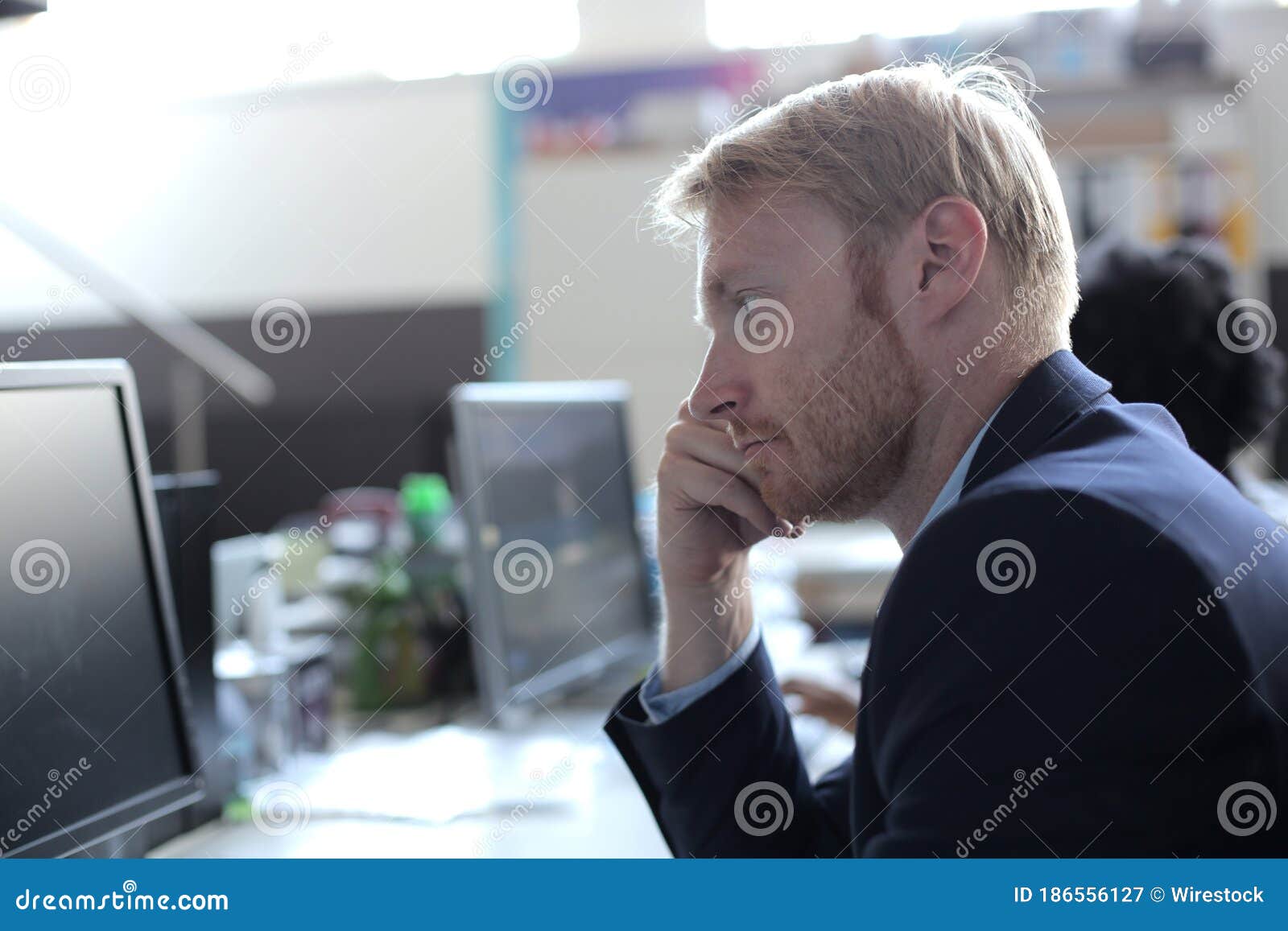 Successful Young Businessman Looking at the Computer Screen Working in ...