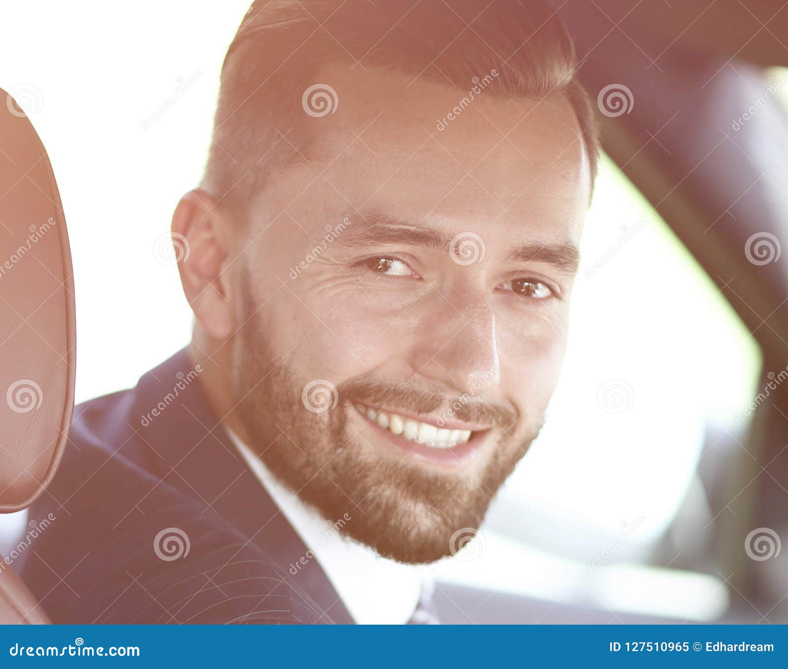 Handsome Young Man Sitting in the Front Seat of a Car Looking at the ...