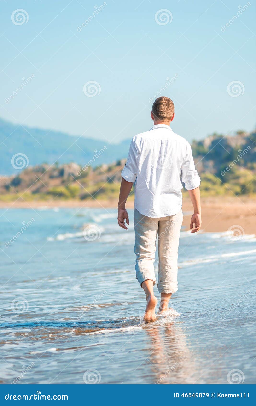 Successful Young Man Walking Along a Beach Stock Image - Image of ...