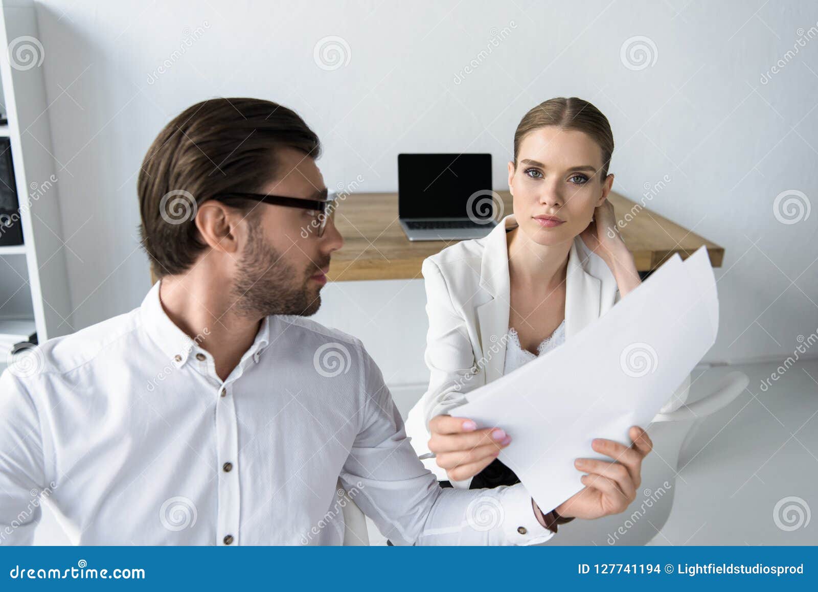 Successful Young Managers Doing Paperwork Together Stock Photo - Image ...