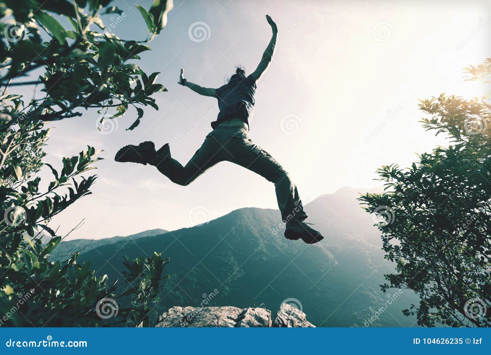 Woman Jumping on Cliff Edge Stock Image - Image of jump, hill: 104626235
