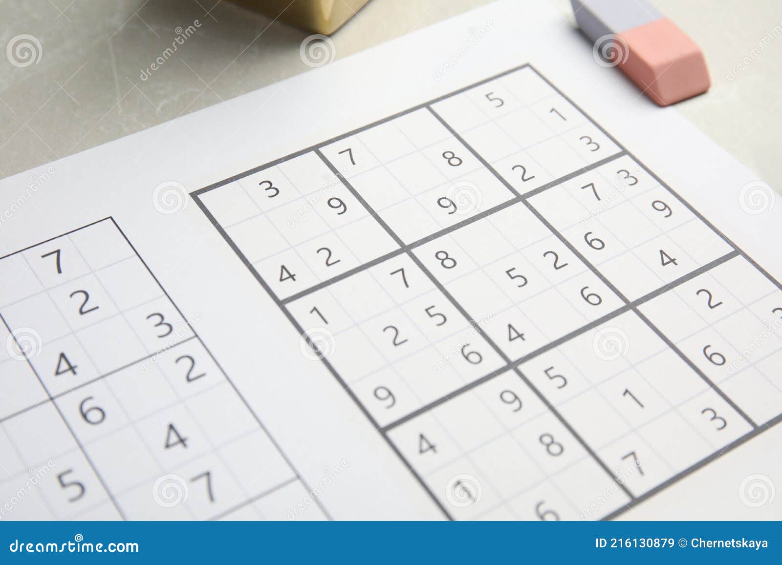 Sudoku and Eraser on Light Table, Closeup Stock Image - Image of logic ...