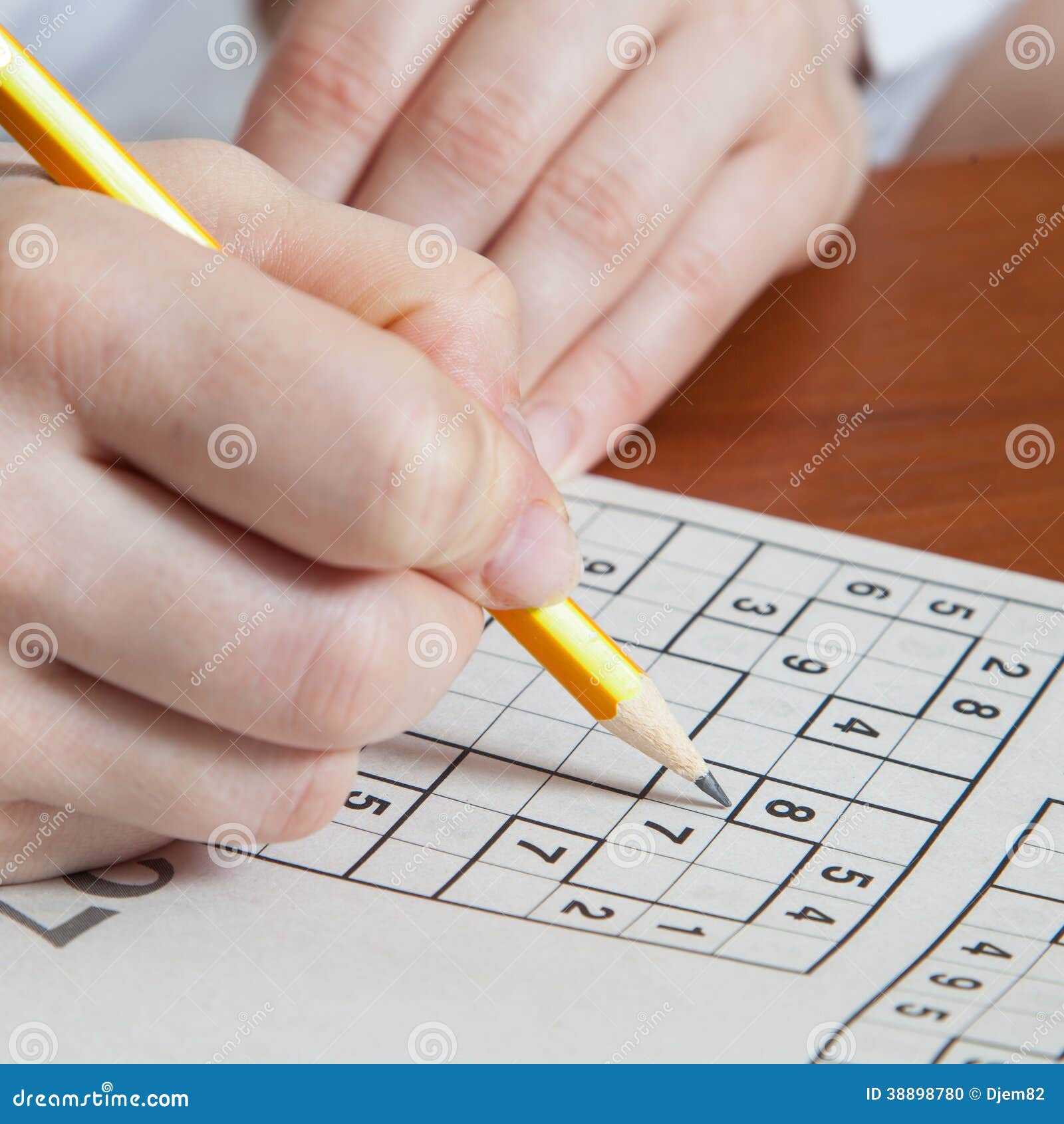 Sudoku stock photo. Image of holding, person, hand, pencil - 38898780