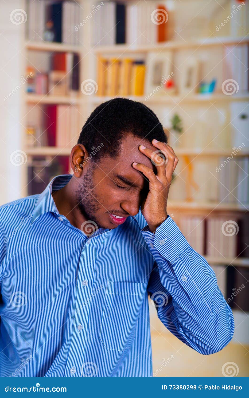 Suffering Face on a Man with a Hand on His Head, Pain Stock Photo ...