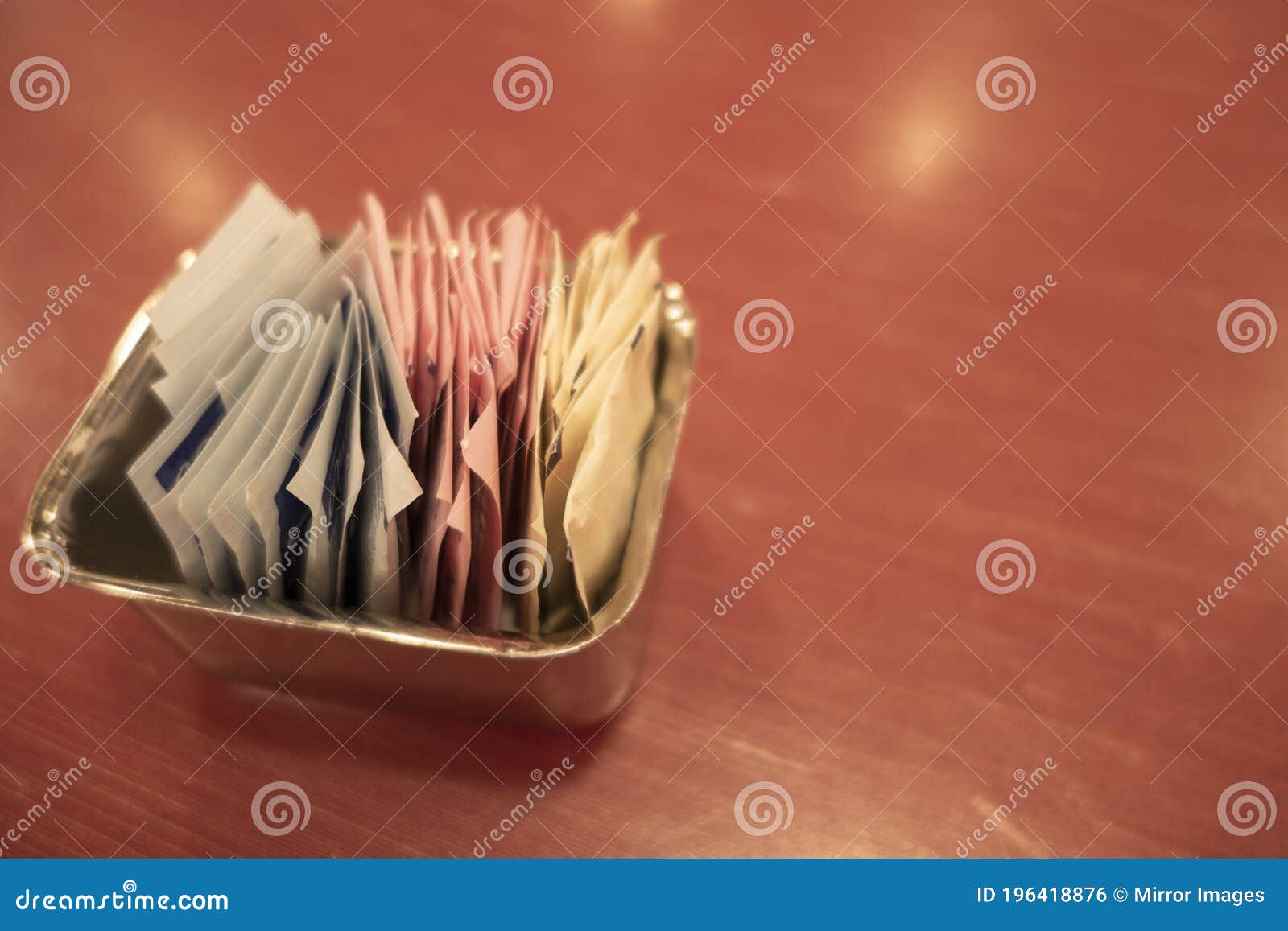 Sugar and Artificial Sweetener Packets on a Wooden Table Stock Photo ...