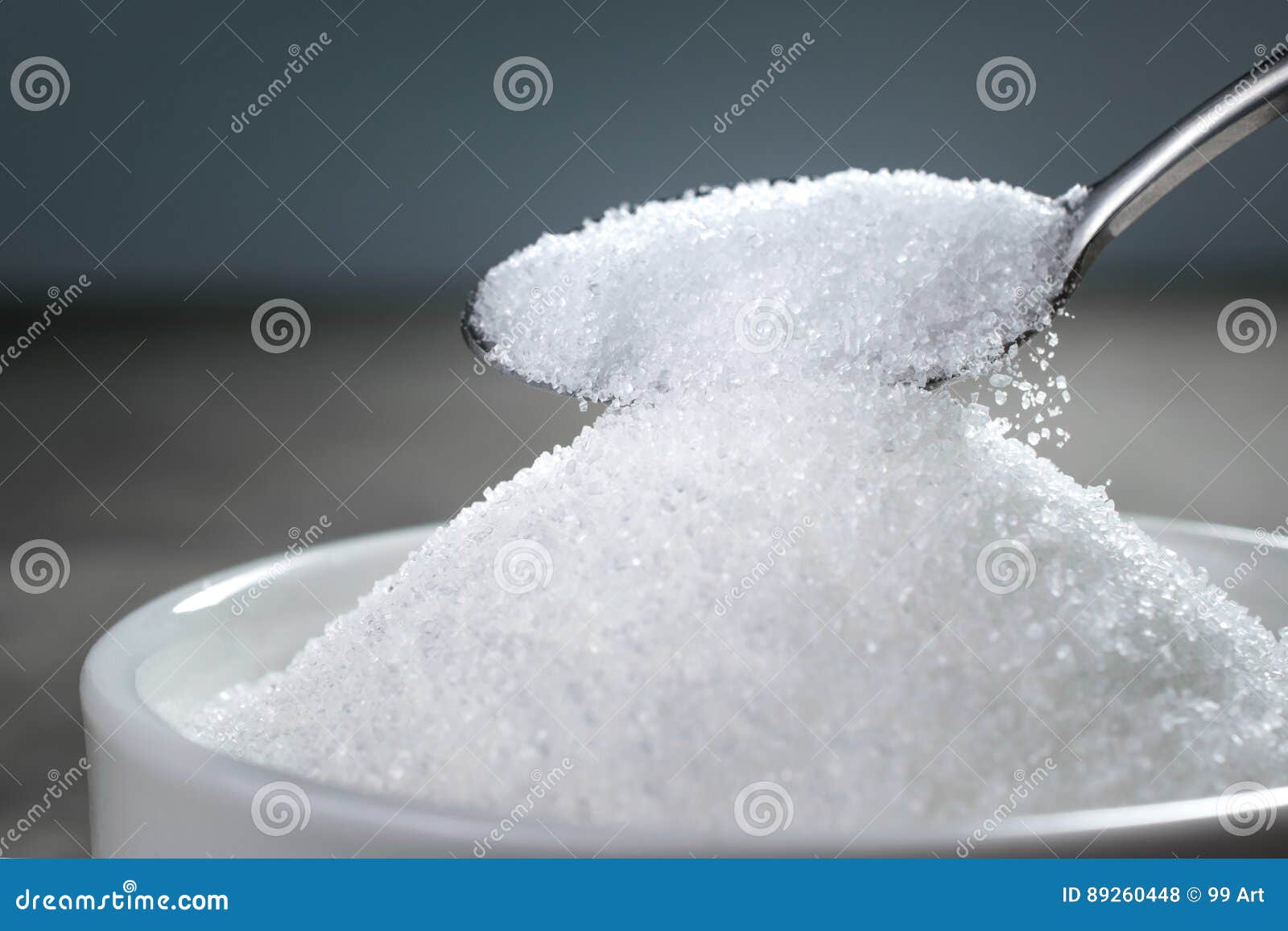 Sugar Being Poured from Spoon into a Bowl Empty Ready for Your P Stock ...