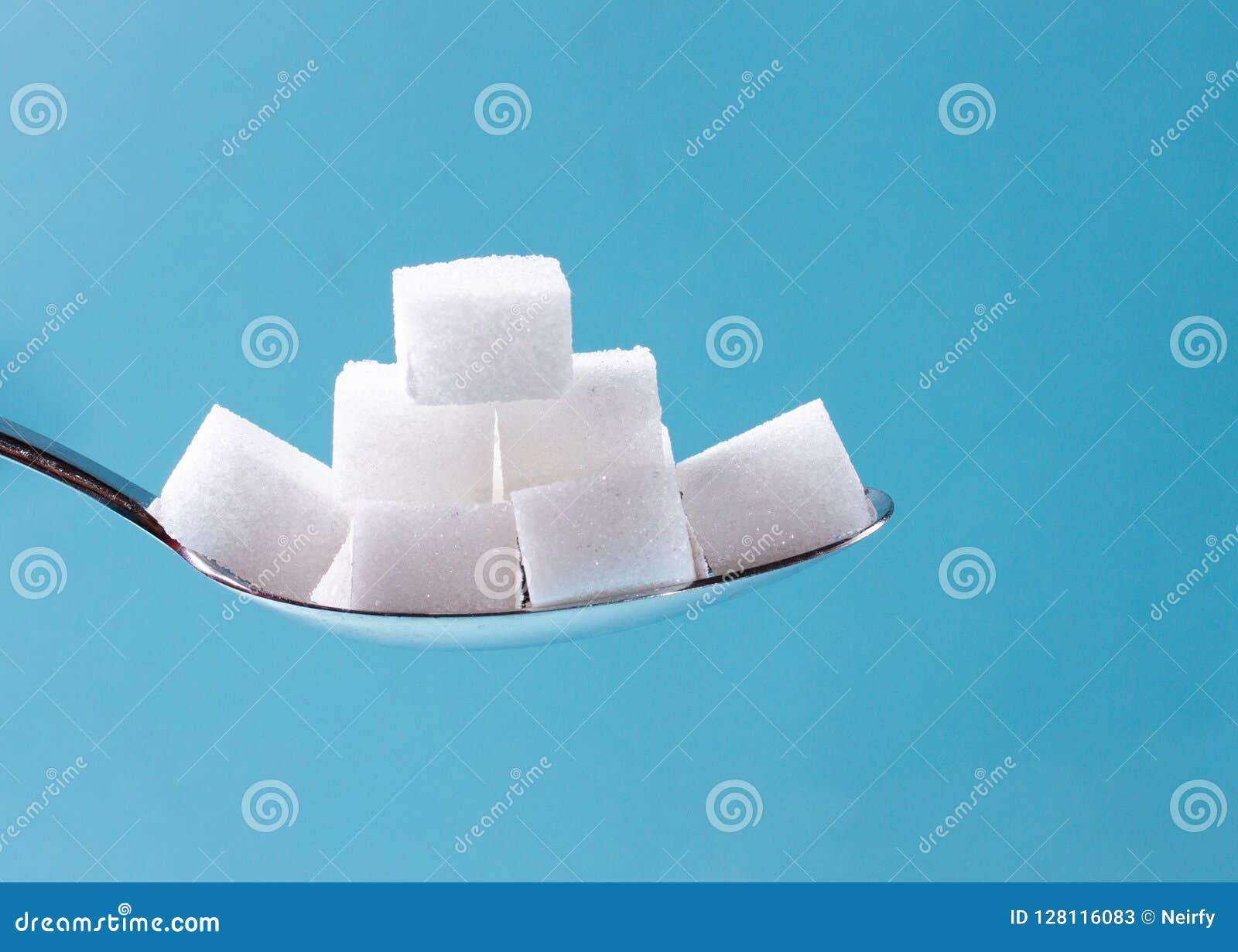 Sugar on blue background stock image. Image of nutrition - 128116083