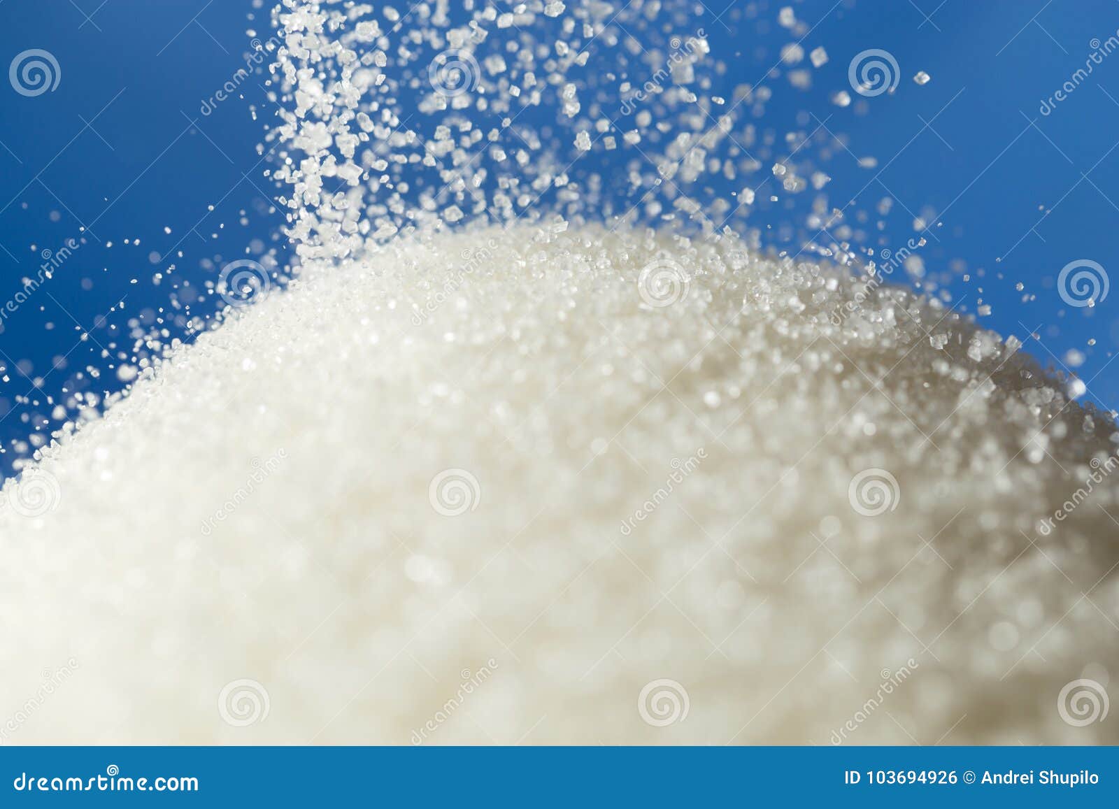 Sugar on a blue background stock photo. Image of blue - 103694926
