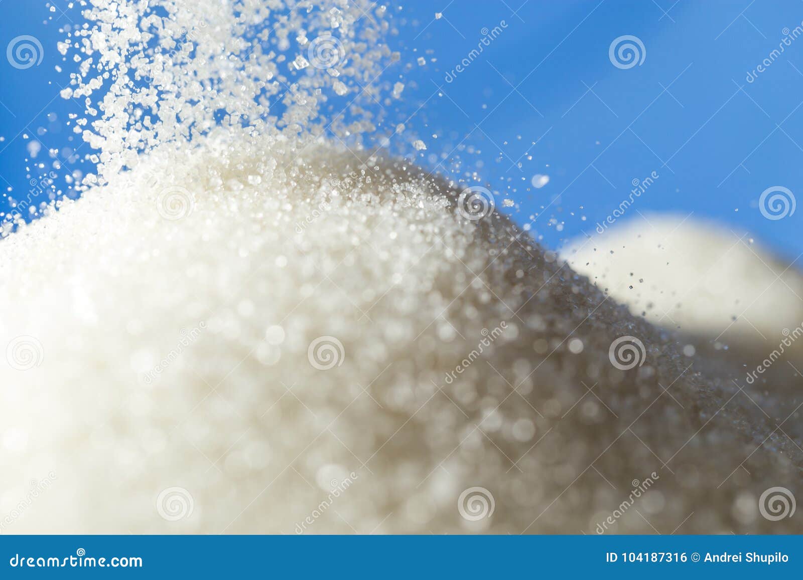 Sugar on a blue background stock photo. Image of sweet - 104187316