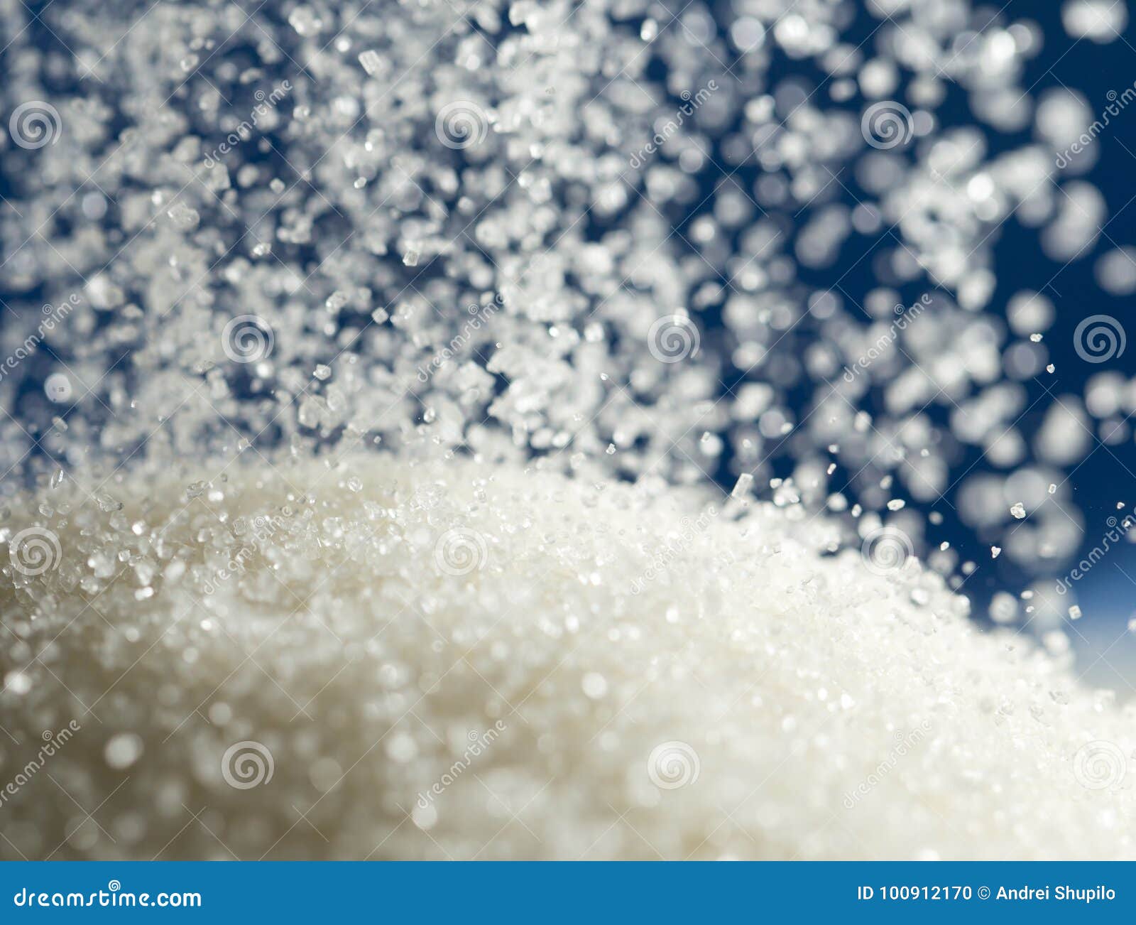 Sugar on a blue background stock photo. Image of background - 100912170