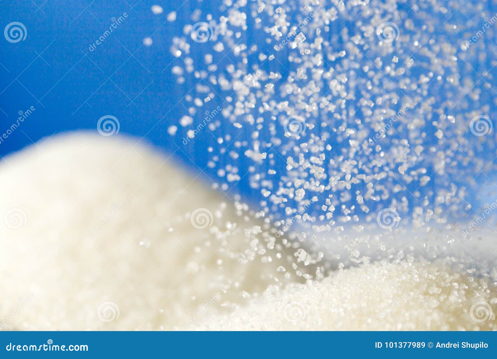 Sugar on a blue background stock image. Image of ingredient - 101377989