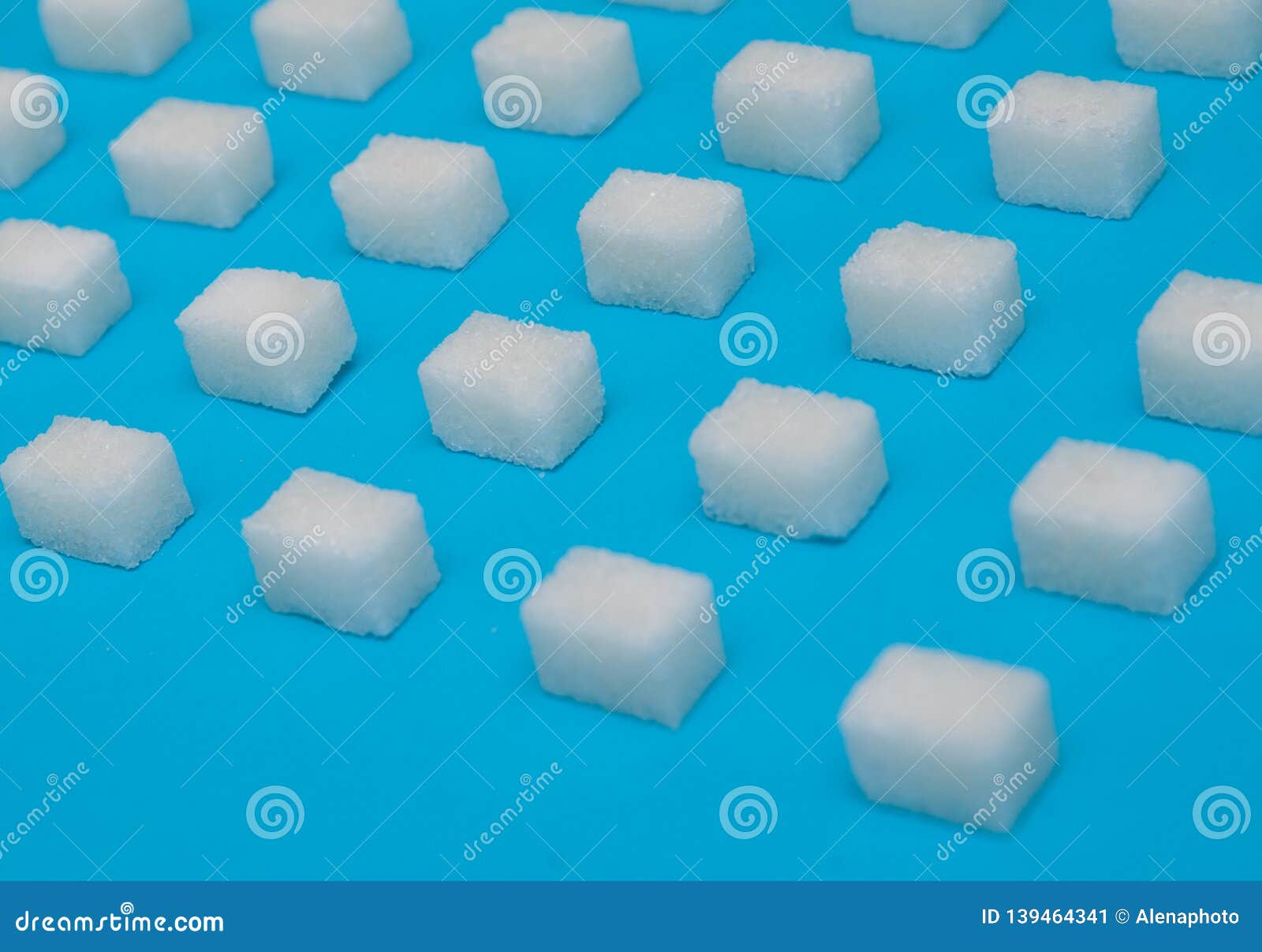 Sugar on blue background. stock image. Image of modern - 139464341