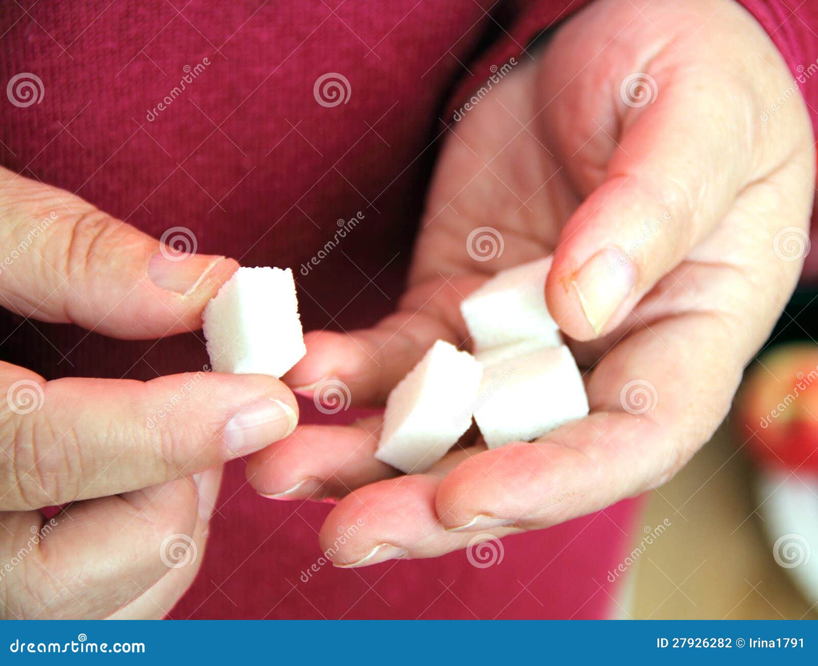 Sugar cubes in the hands stock photo. Image of gammer - 27926282