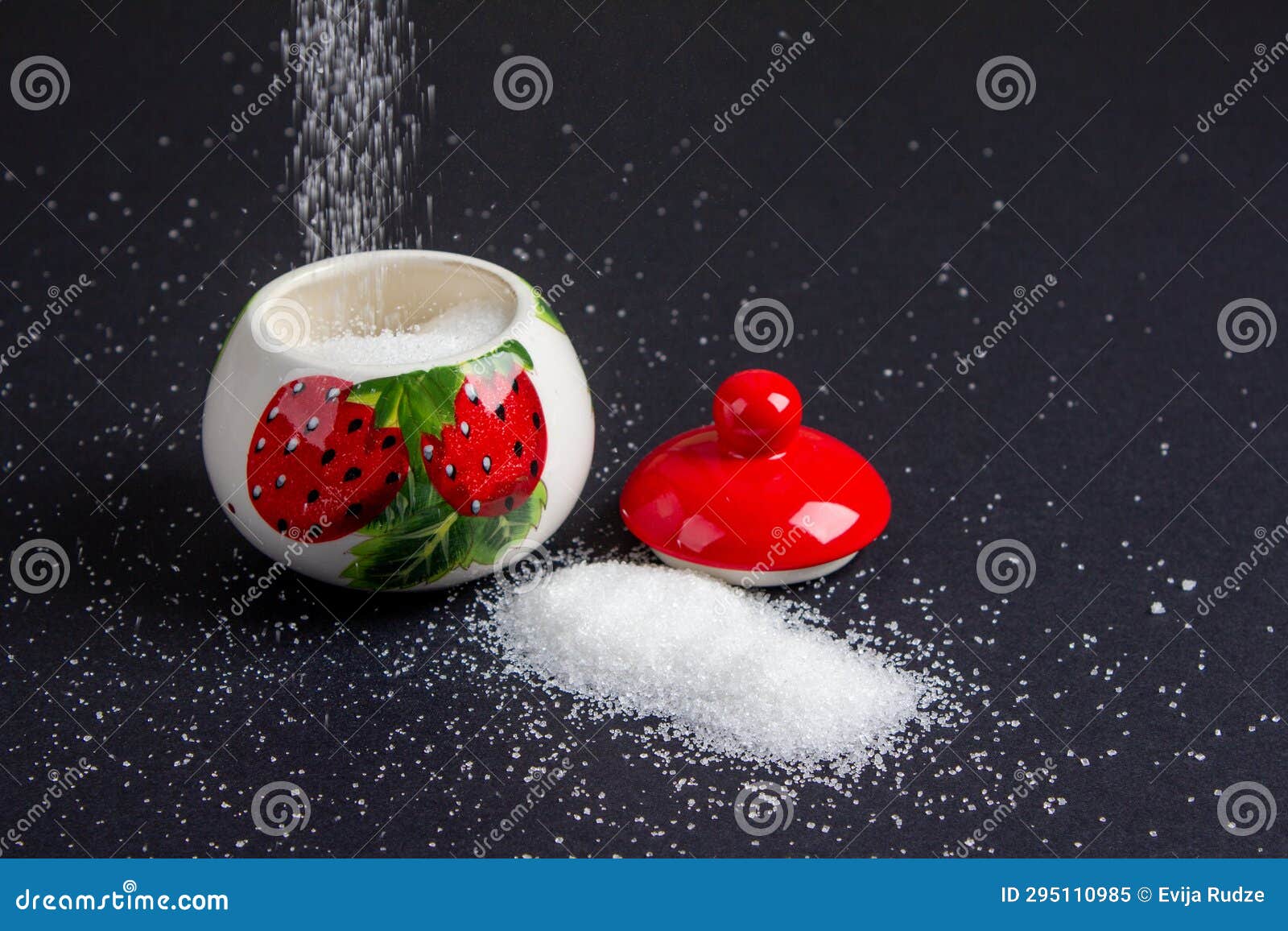 Sugar Explosion in a Sugar Bowl with Strawberries on a Black Background ...
