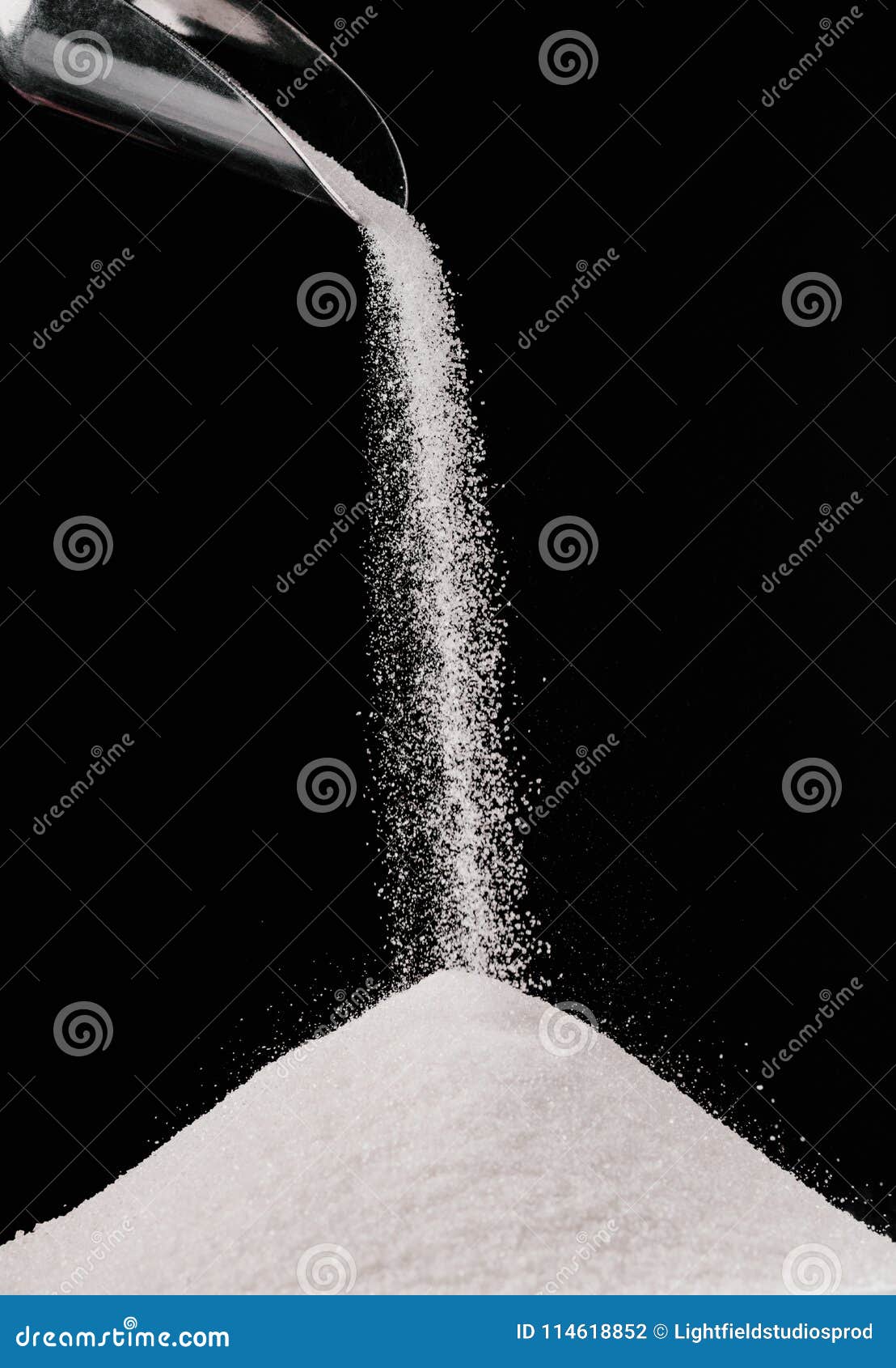 Sugar Falling from Metal Scoop on Pile Stock Photo - Image of minimal ...