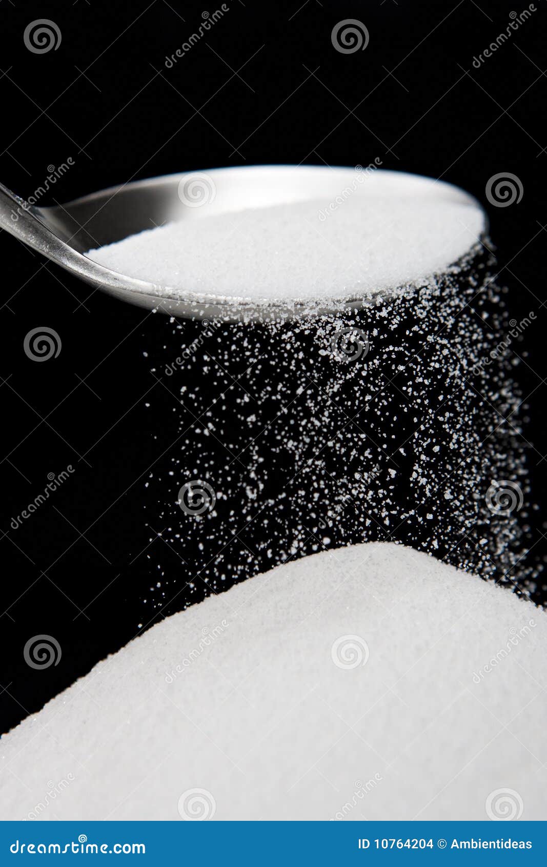 Sugar Falling from Spoon stock photo. Image of steel - 10764204