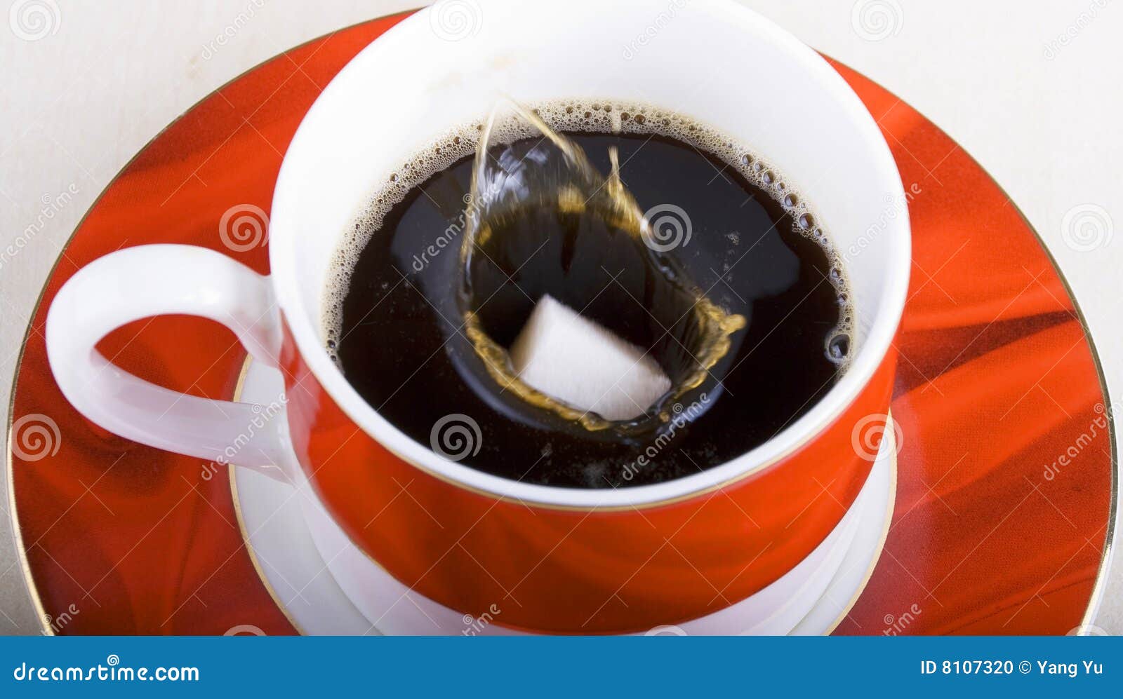 Sugar Lump Falling into Cup of Tea Stock Photo - Image of saucer, sugar ...