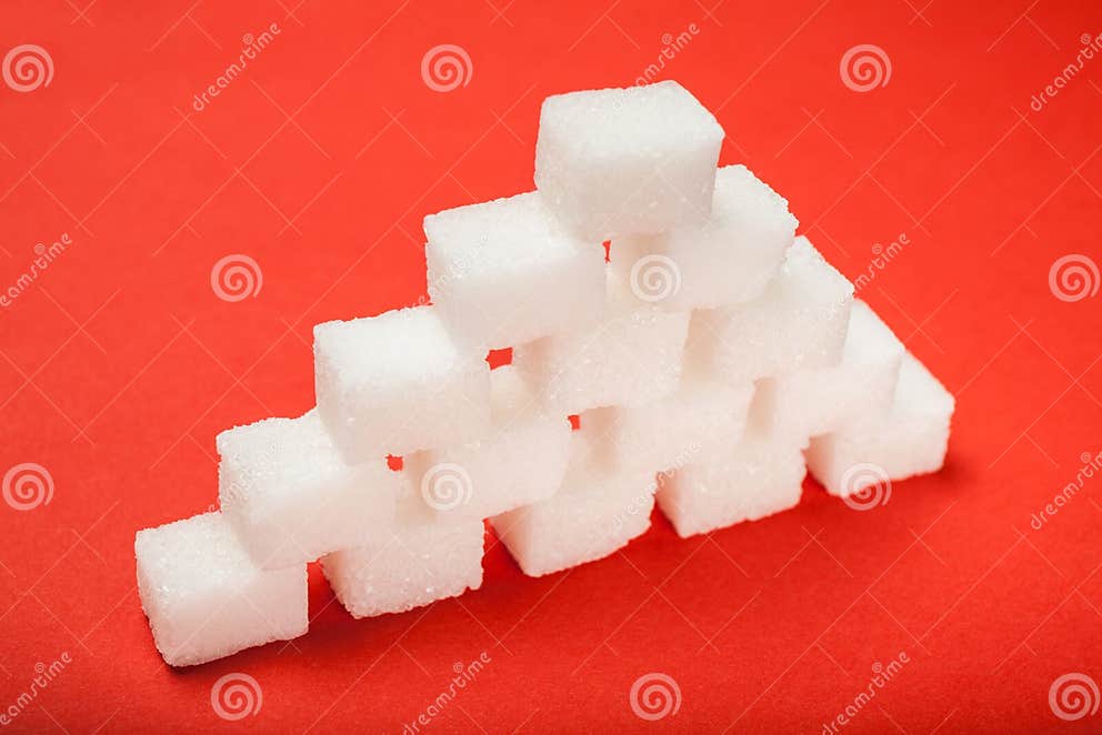 Sugar Pyramid on a Red Background Stock Image - Image of sugar ...