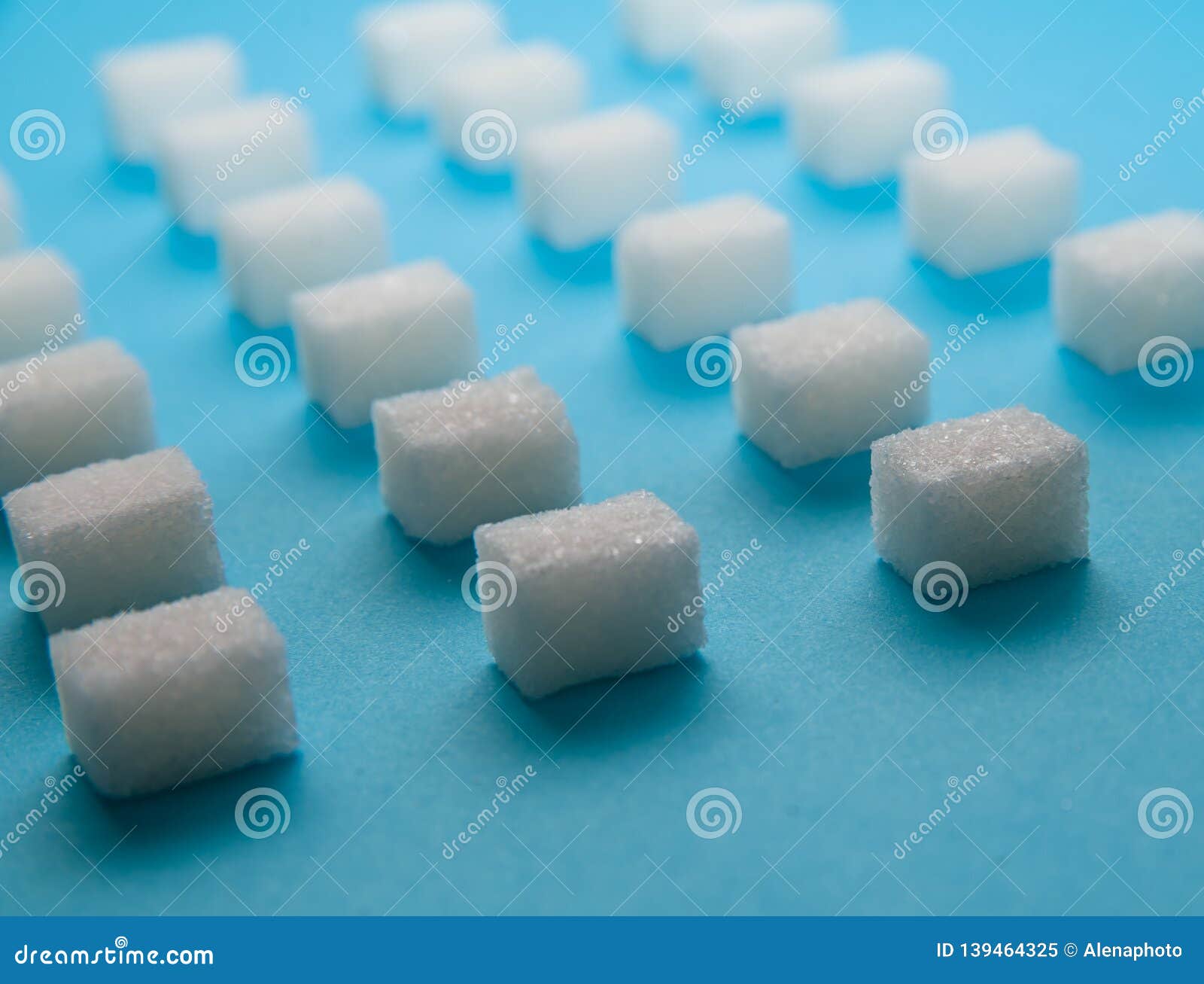 Sugar on blue background. stock image. Image of white - 139464325
