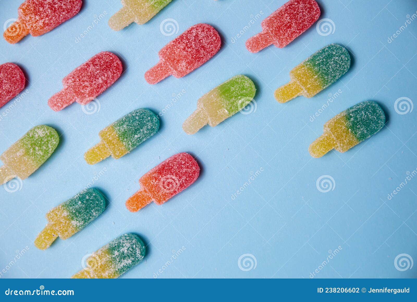 Sugary Gummy Popsicle Candy Pattern on Blue Stock Photo - Image of ...