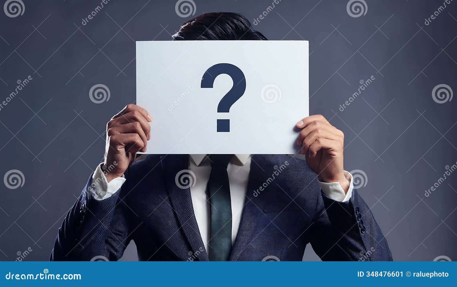 A Suit Holds a Sign Obscuring Their Face a Question Mark is on the Sign ...