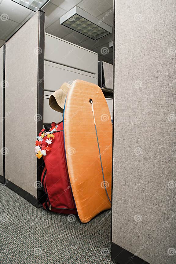 Suitcase and Body Board in Office Cubicle Stock Photo - Image of ...