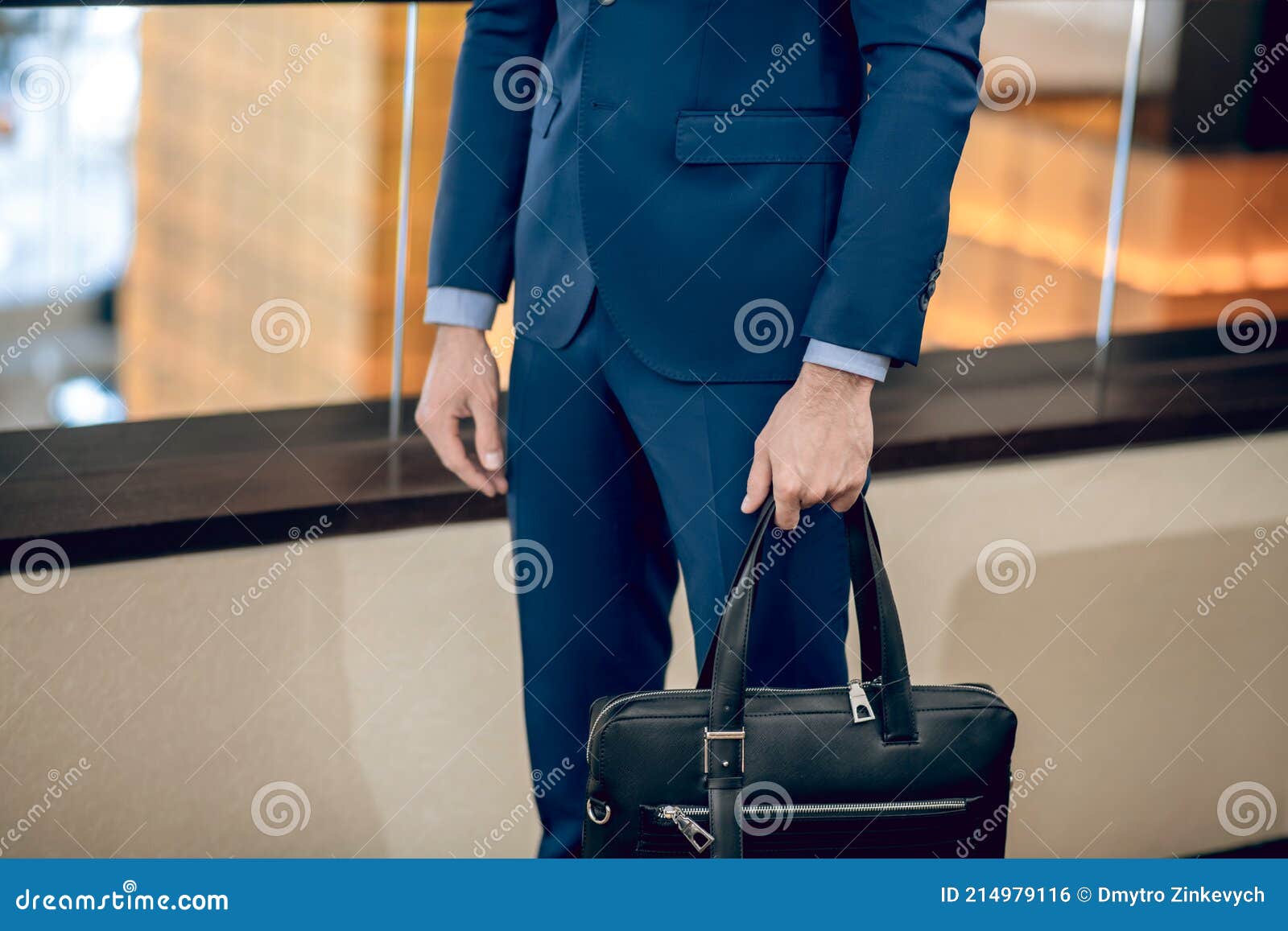 Buisnessman in a Blue Suit Holding a Suitcase Stock Photo - Image of ...