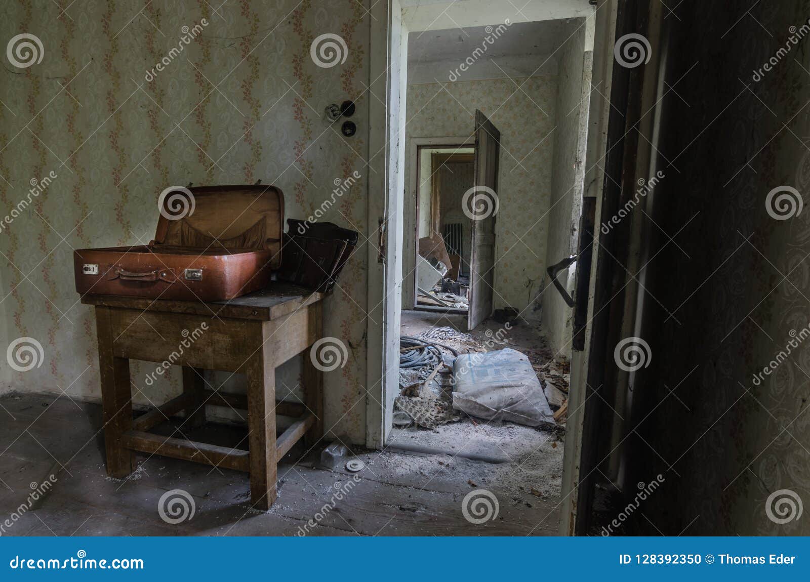 Suitcase on table in house stock photo. Image of facade - 128392350