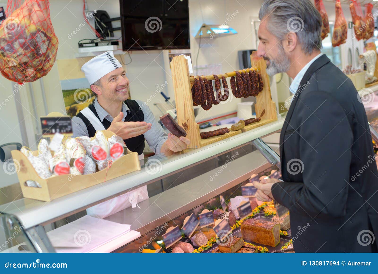 Suited Man Being Served by Butcher Stock Photo - Image of protein, hold ...