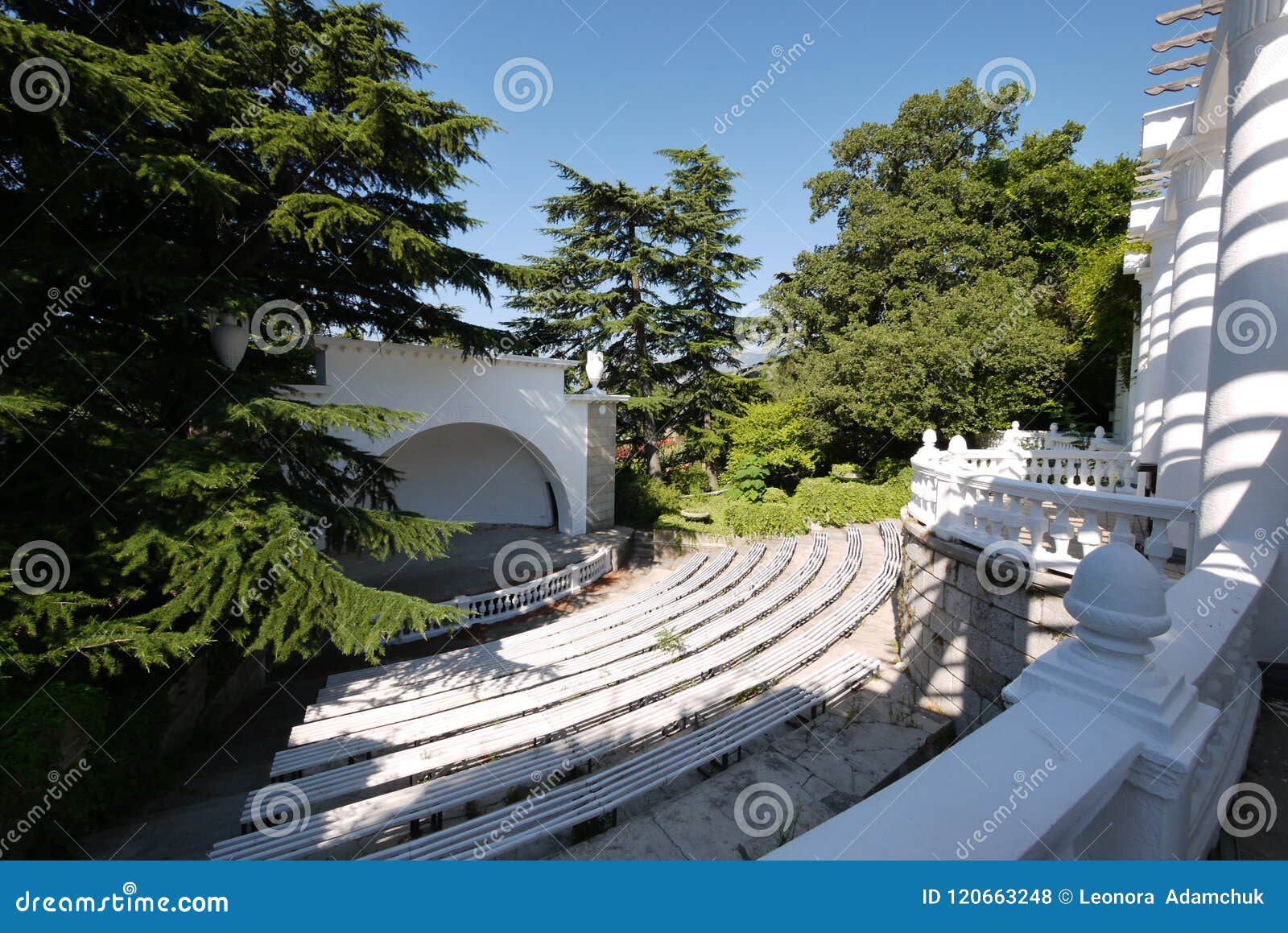 Summer Amphitheater with Several Rows of Benches, a Spacious White ...