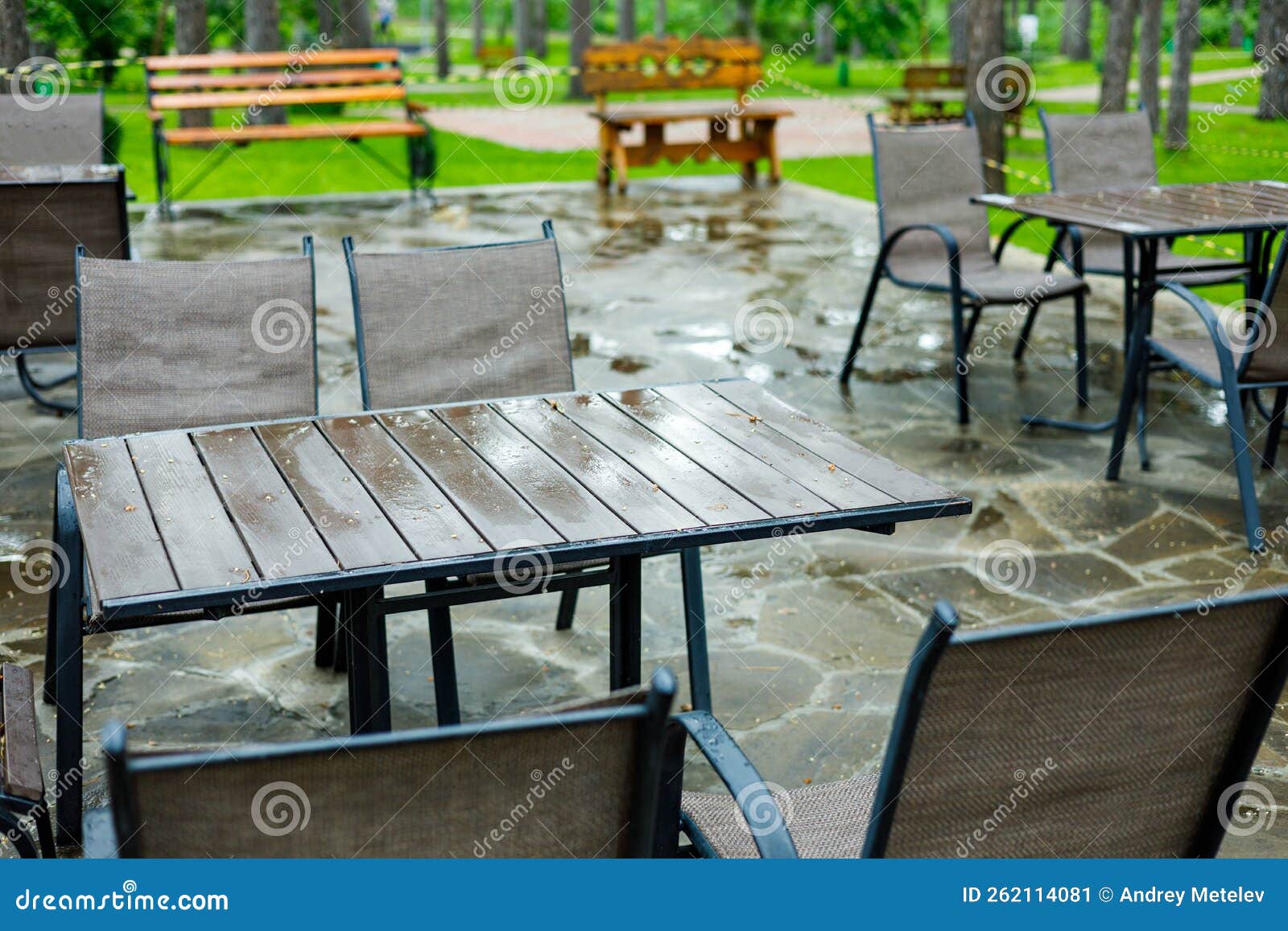 Summer Cafe Table and Chairs Outdoors after Rain. Wet Tables and Chairs ...