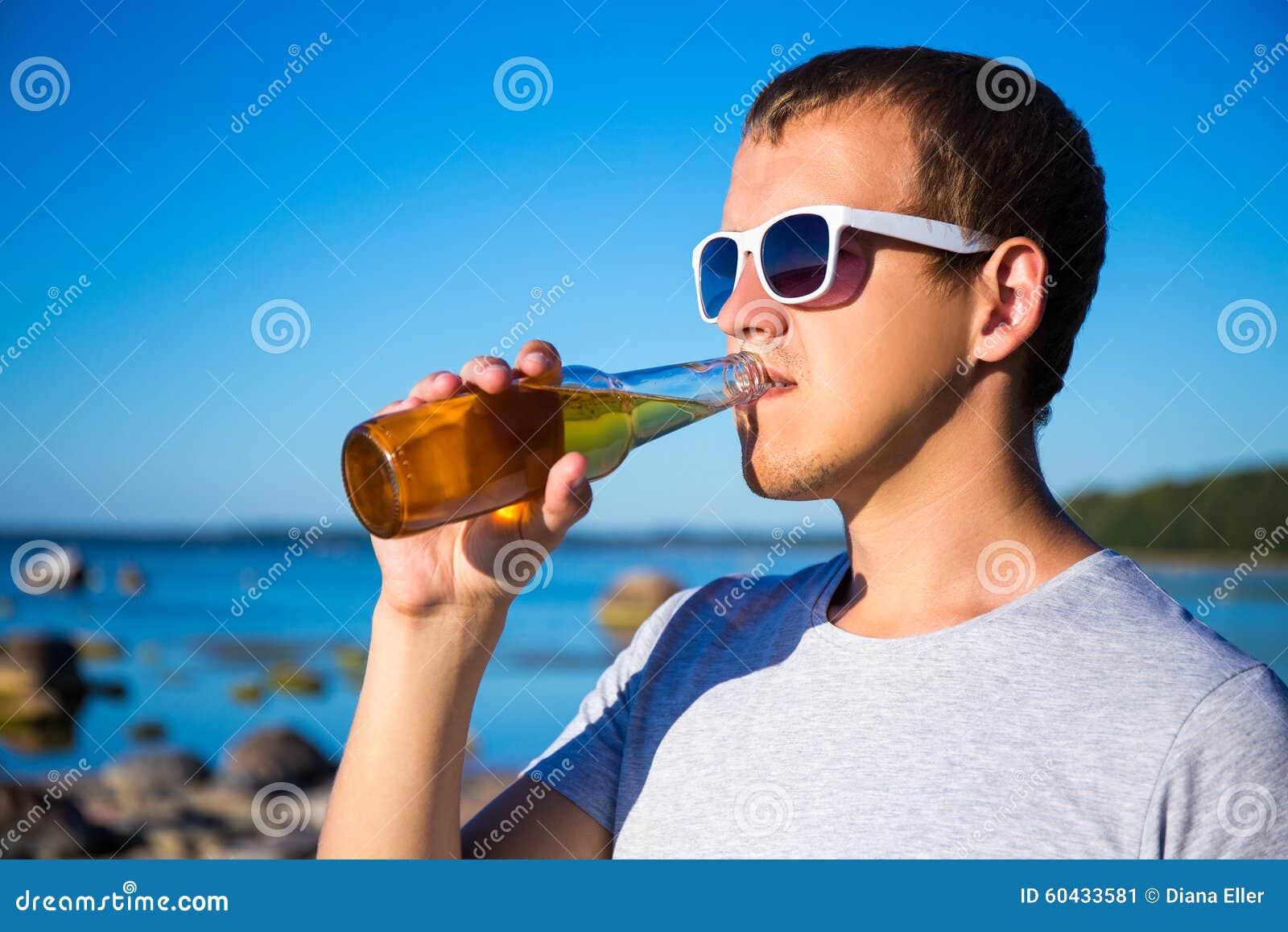 Summer Concept - Handsome Man Drinking Beer on the Beach Stock Image ...