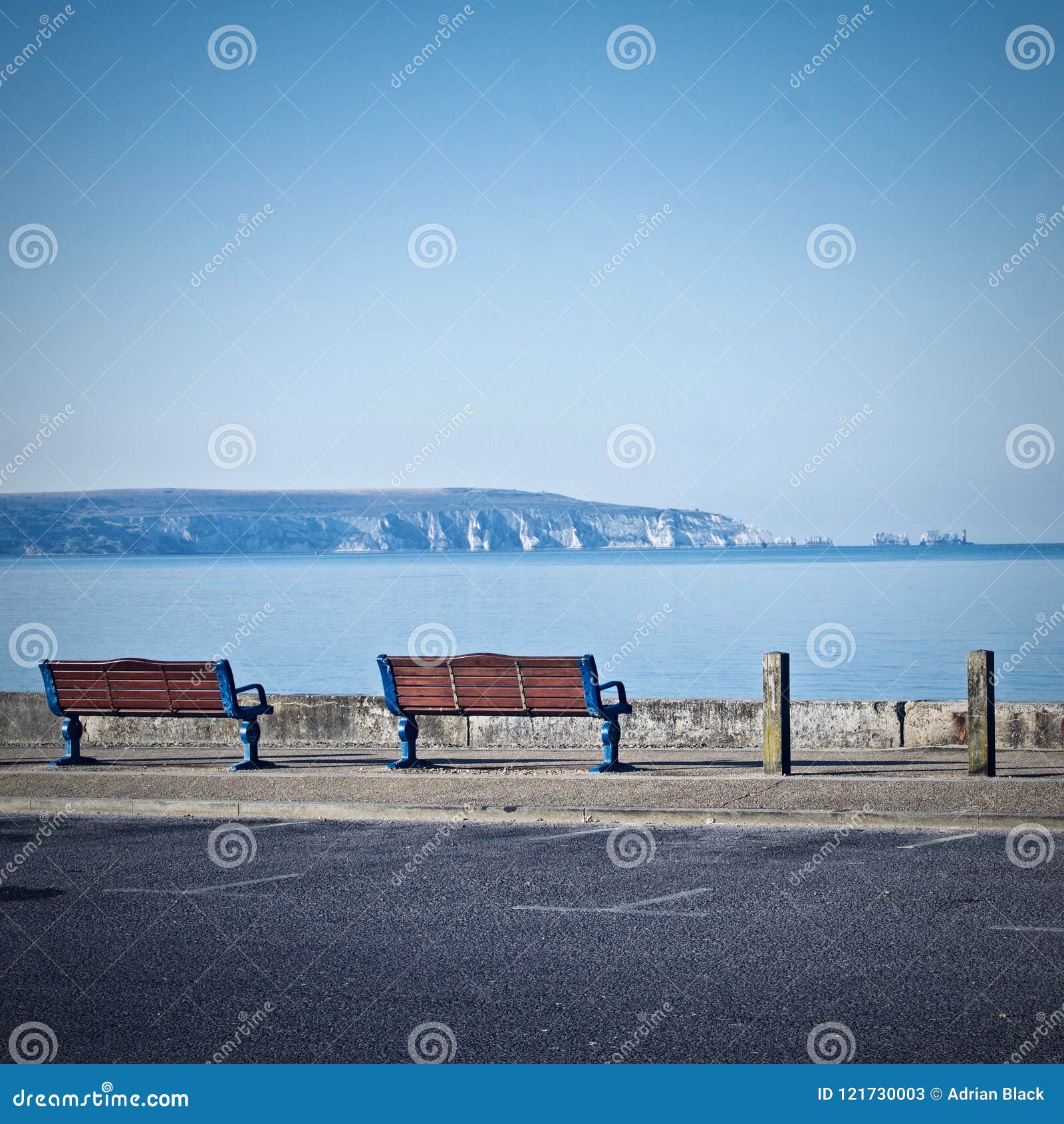 Two benches by the sea stock image. Image of landscape - 121730003
