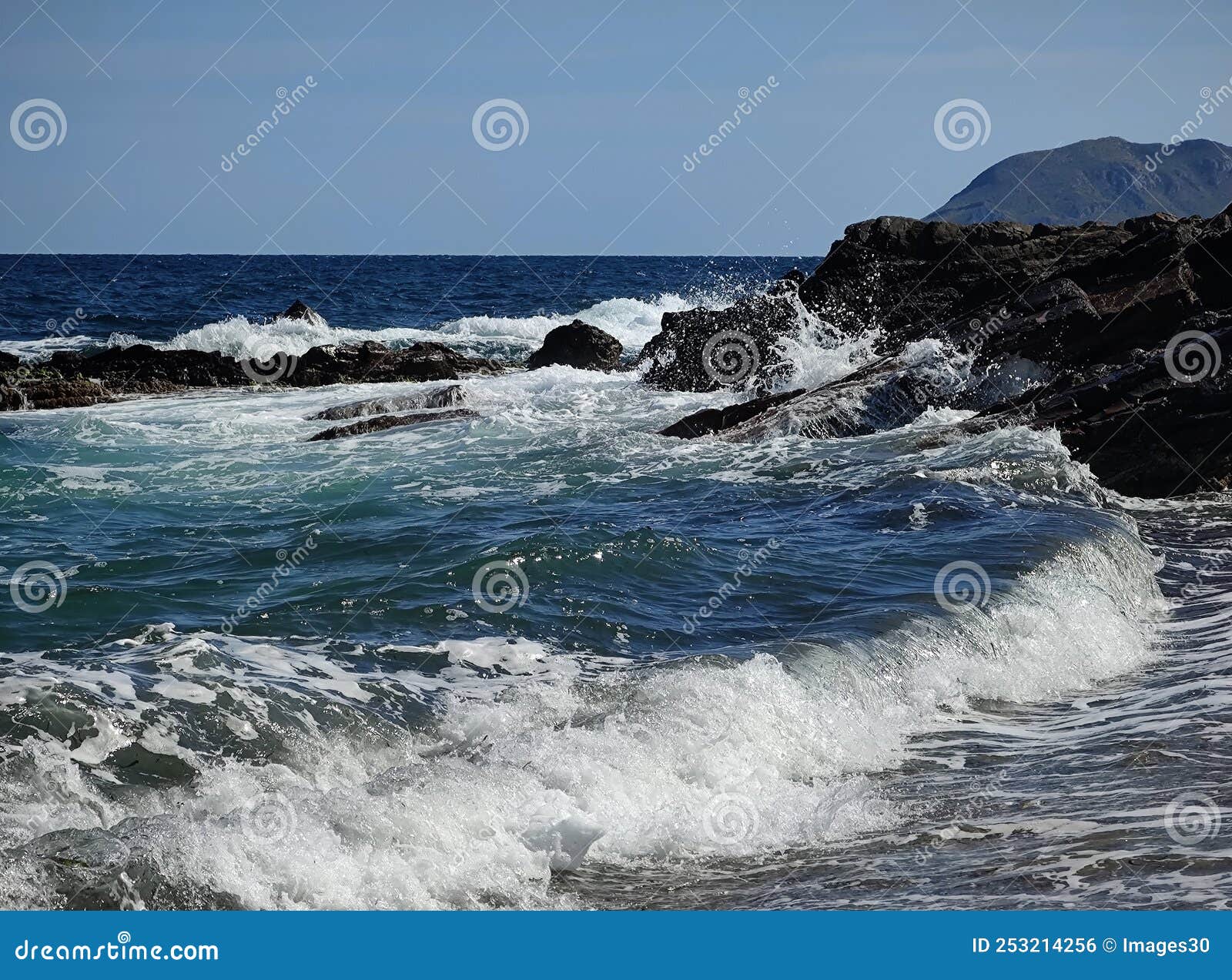 Summer Fun Dynamic Waves Breaking on Rocks Blue Sky and Sunshine Stock ...