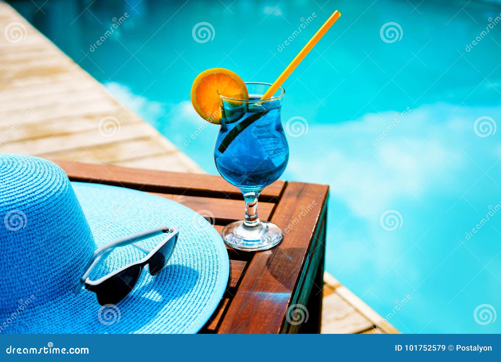 Summer Hat, a Cocktail and Sunglasses Near the Luxurious Pool. Stock ...