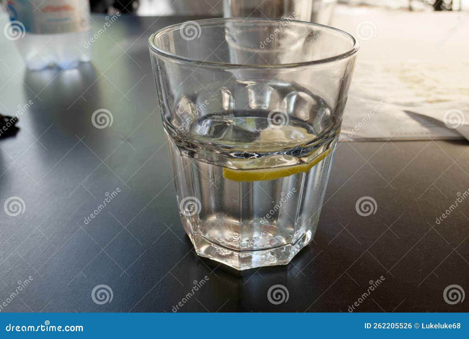 Summer Refreshing Drink on the Rocks with Lemon Slice . Glass on the ...