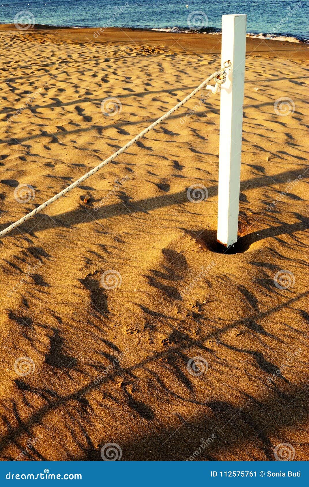 Summer Sea, White Pole with Rope on the Beach at Dawn Stock Image ...