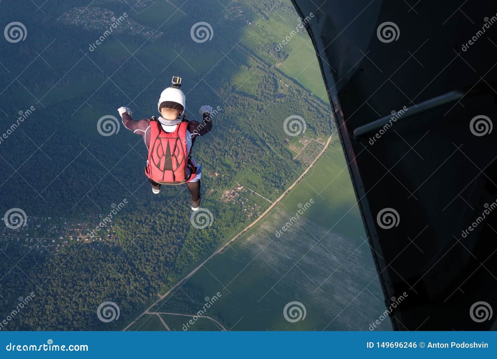 Skydiving. a Skydiver is Jumping Out of a Plane. Stock Photo - Image of ...