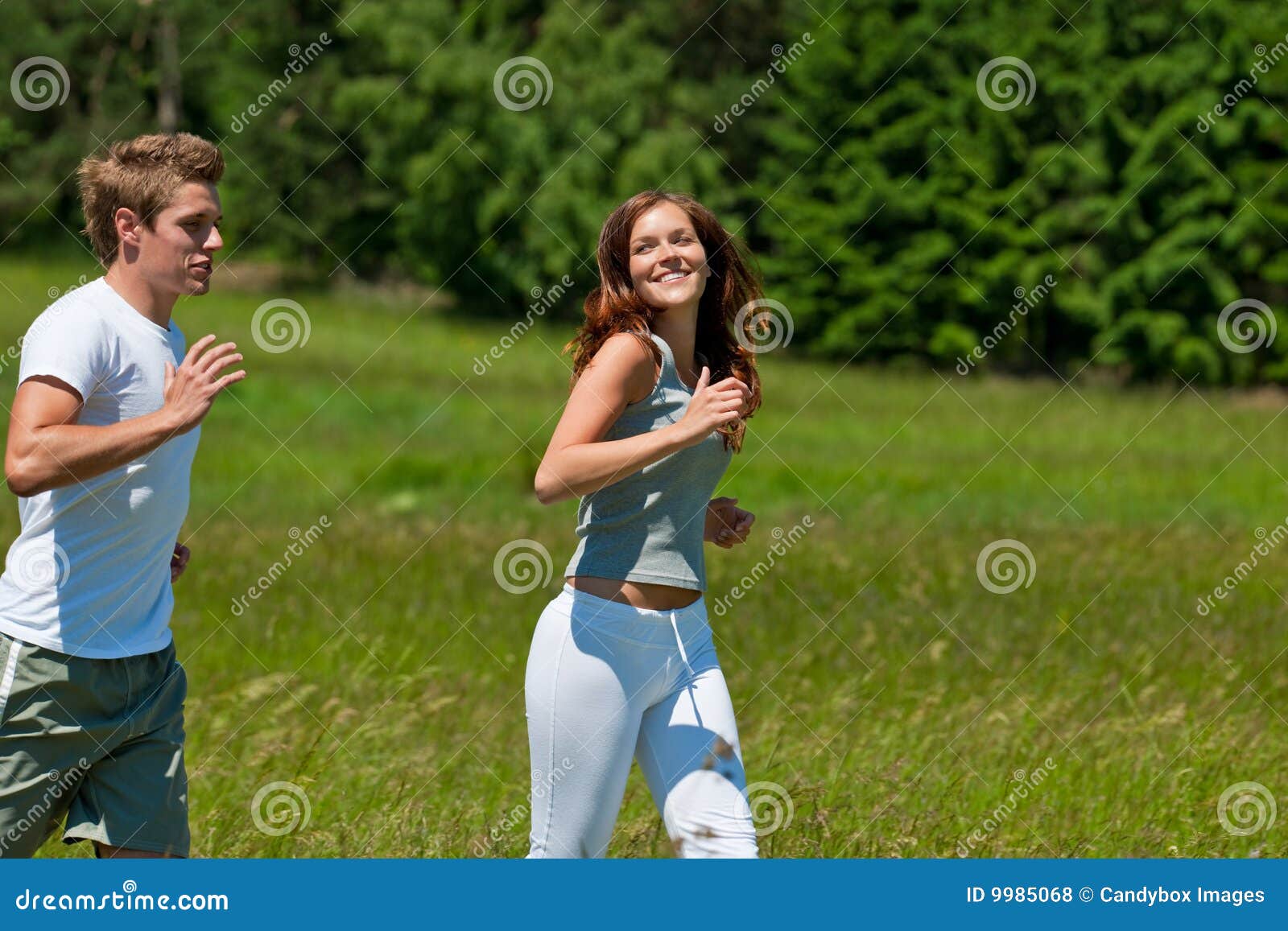Summer - Smiling Couple Jogging in Meadow Stock Photo - Image of sport ...