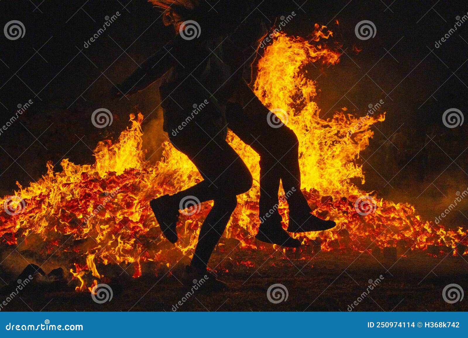 Summer Solstice Celebration Jumping into the Fire. Burning Flames Stock ...