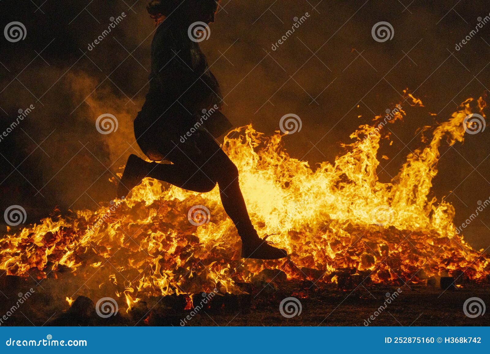 Summer Solstice Celebration Jumping into the Fire. Burning Flames Stock ...