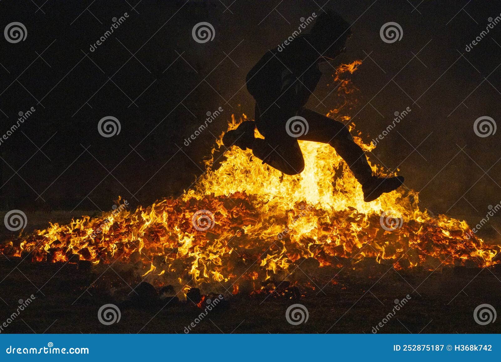 Summer Solstice Celebration Jumping into the Fire. Burning Flames Stock ...