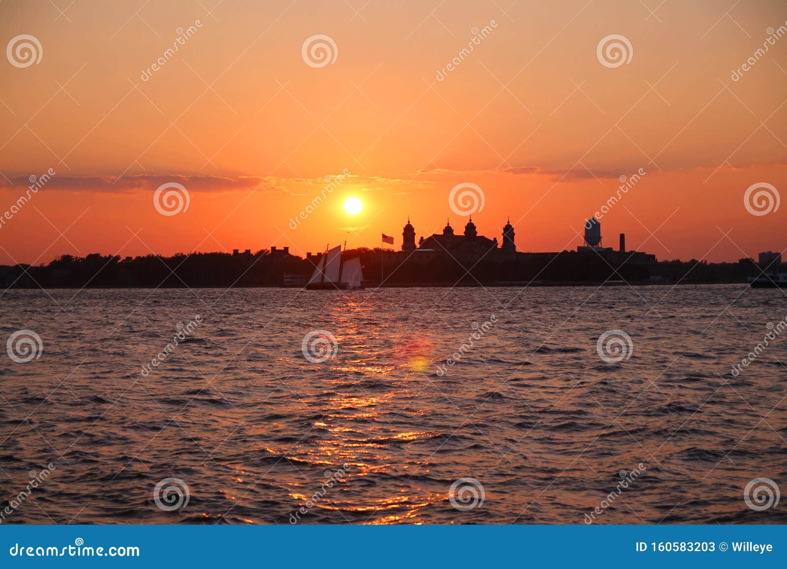 Ellis Island sunset stock image. Image of sailing, flare - 160583203