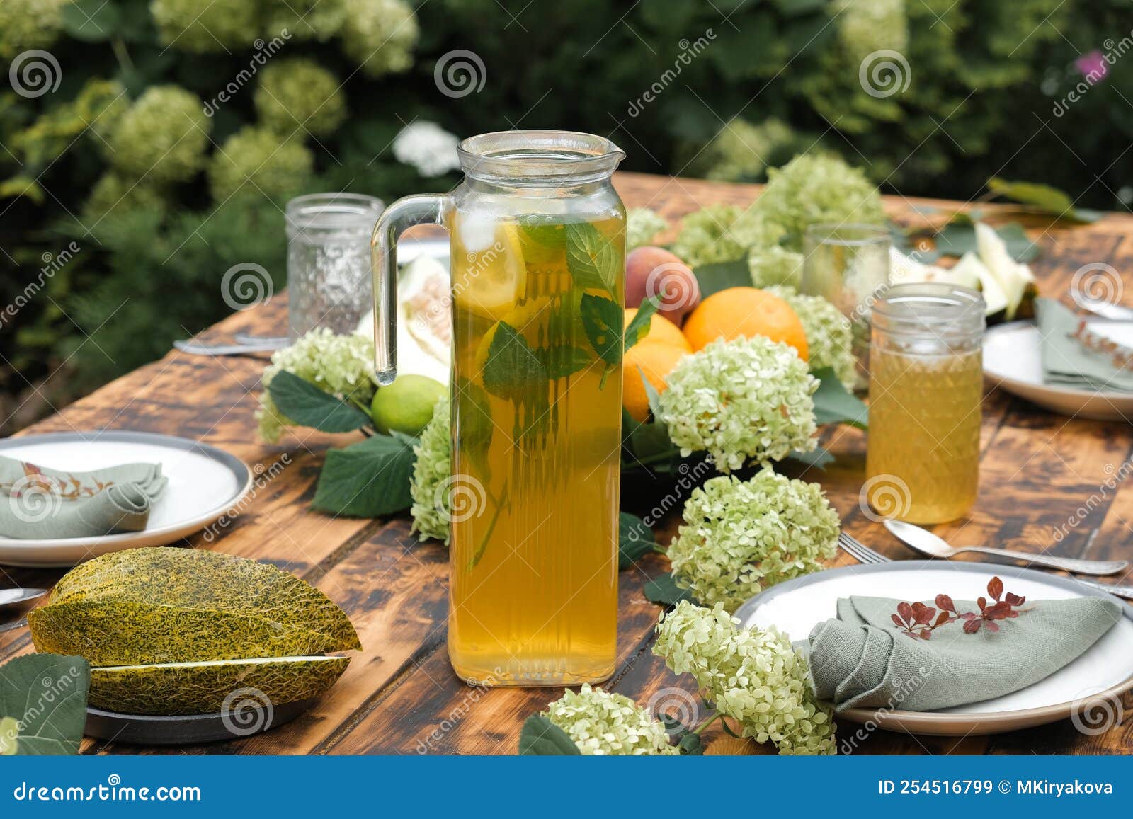 Summer Table Set in Backyard. Lemonade Decanter on Dining Table. Stock ...