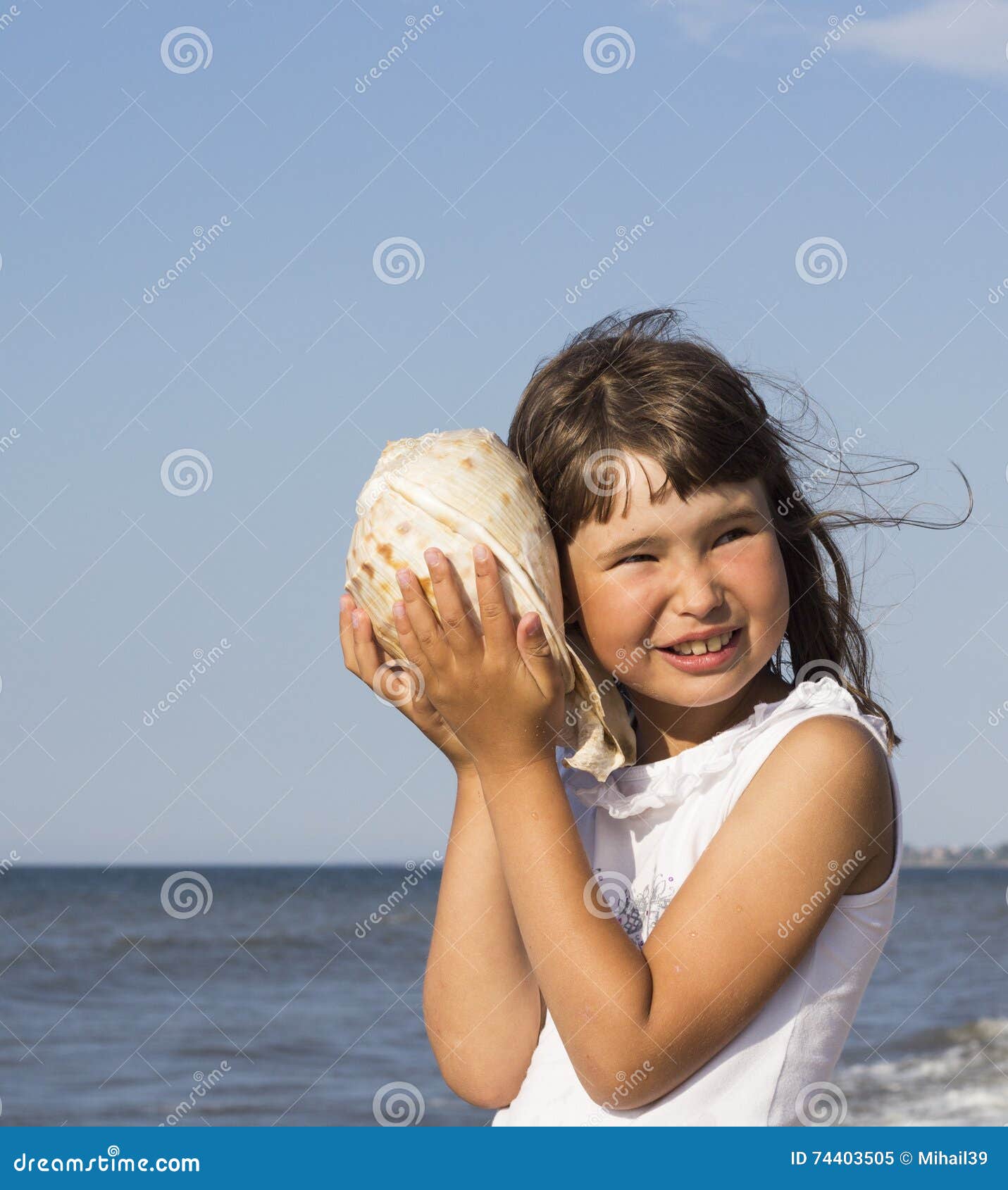 Summer Vacation - Beautiful Girl with Shell at the Beach Stock Image ...