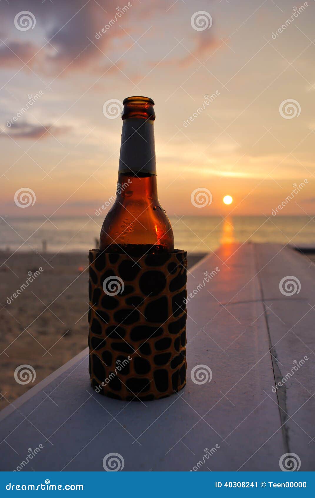 In a Summer Vacation. Bottle of Beer on the Beach at Sunset Stock Image ...