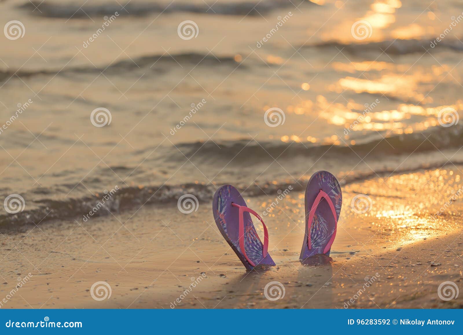 Summer Vacation Concept. Colorful Flip Flops on the Sandy Beach during ...