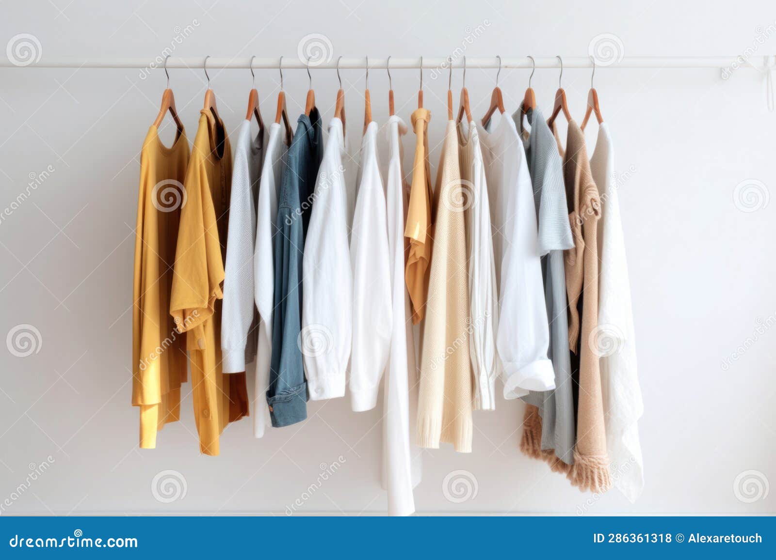 Summer Capsule Wardrobe With Women Casual Clothes On Hanger Rail ...